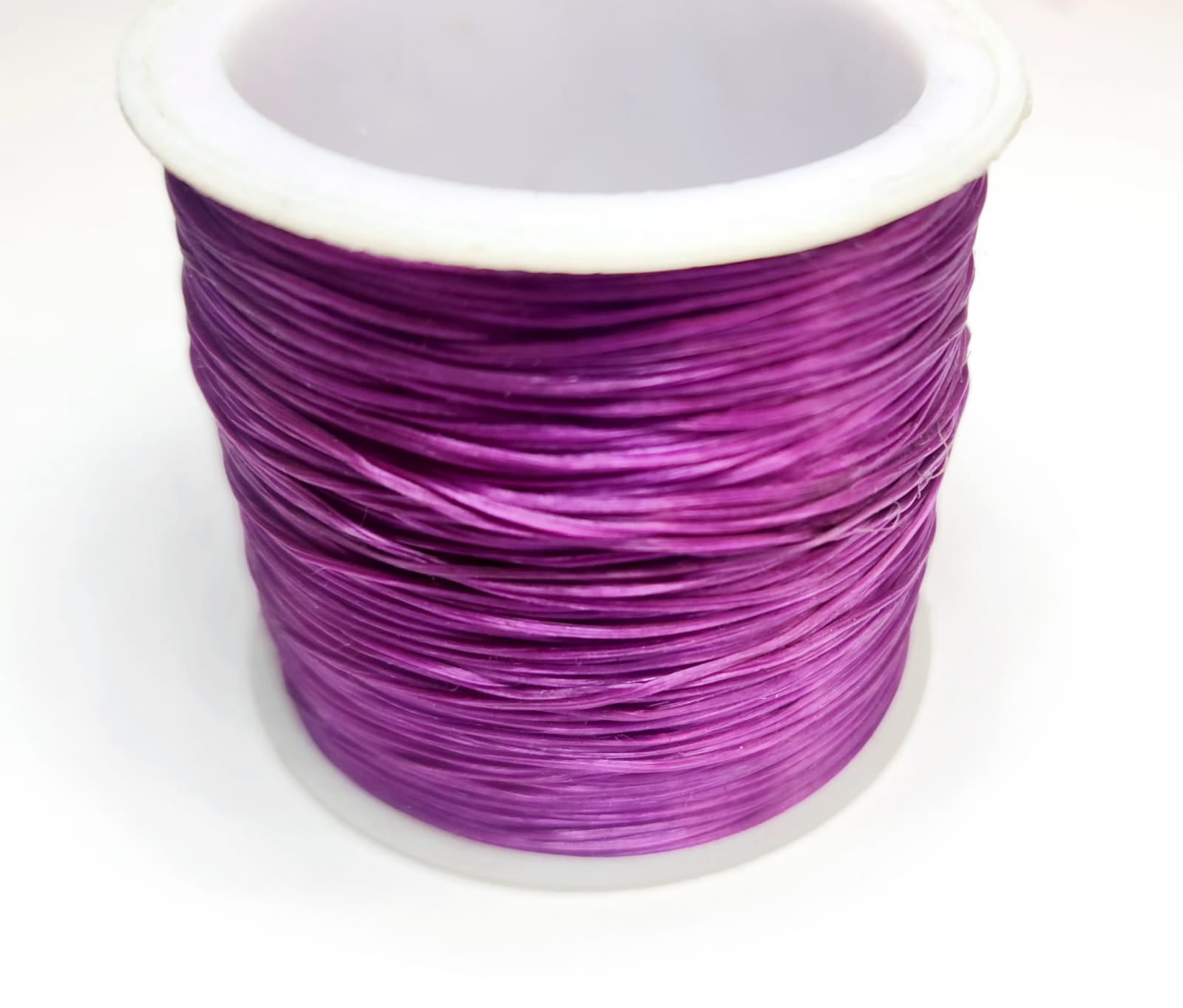 HILO ELÁSTICO PLANO | 0.5MM | 50MTRS | MAGENTA – CrystalStone