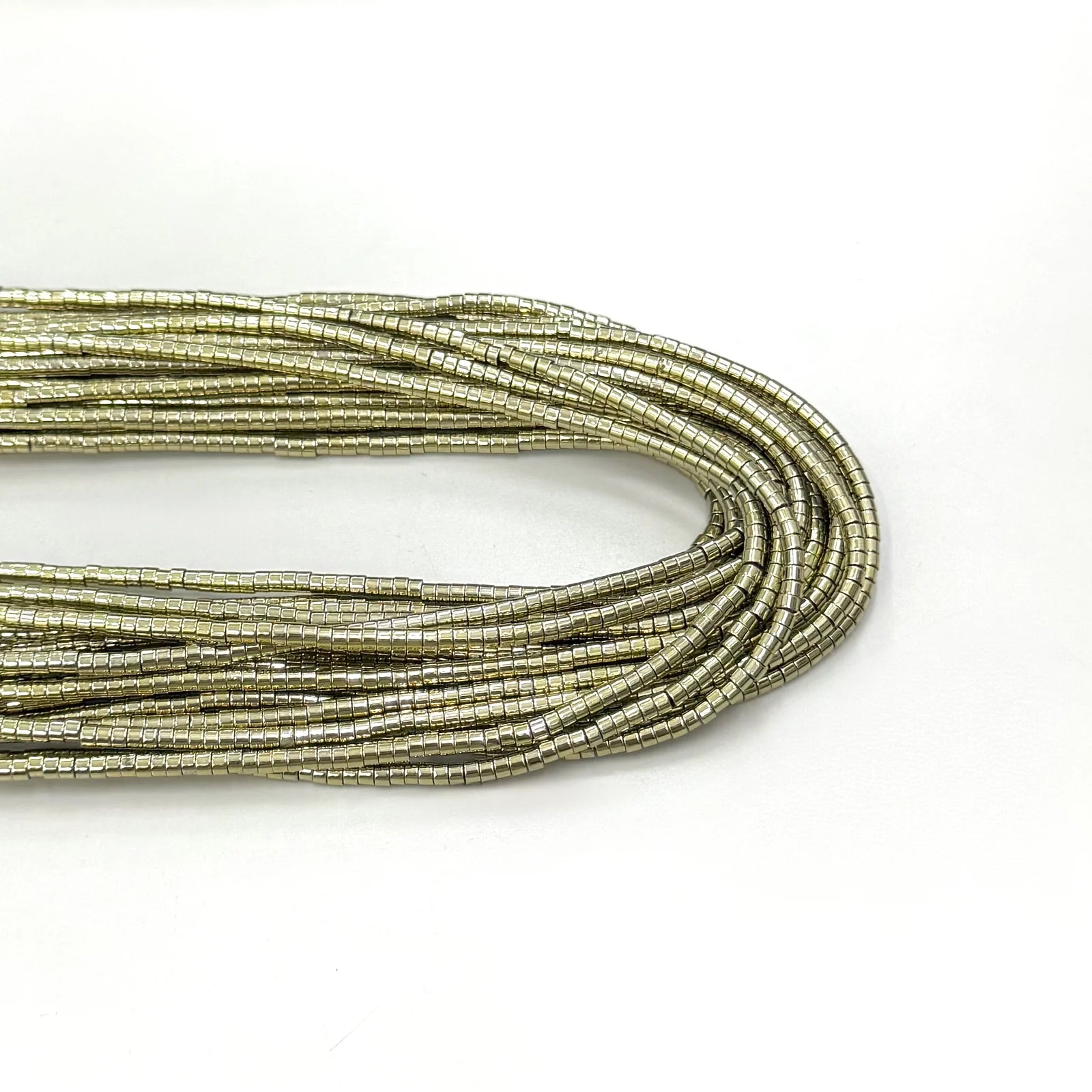 HEMATITA | CILINDRO CORTO | 2.1MM X 3MM | DORADO CLARO – CrystalStone